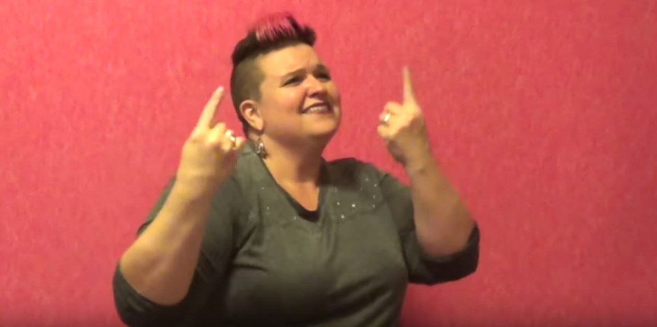 videos of ASL interpreters signing rock songs