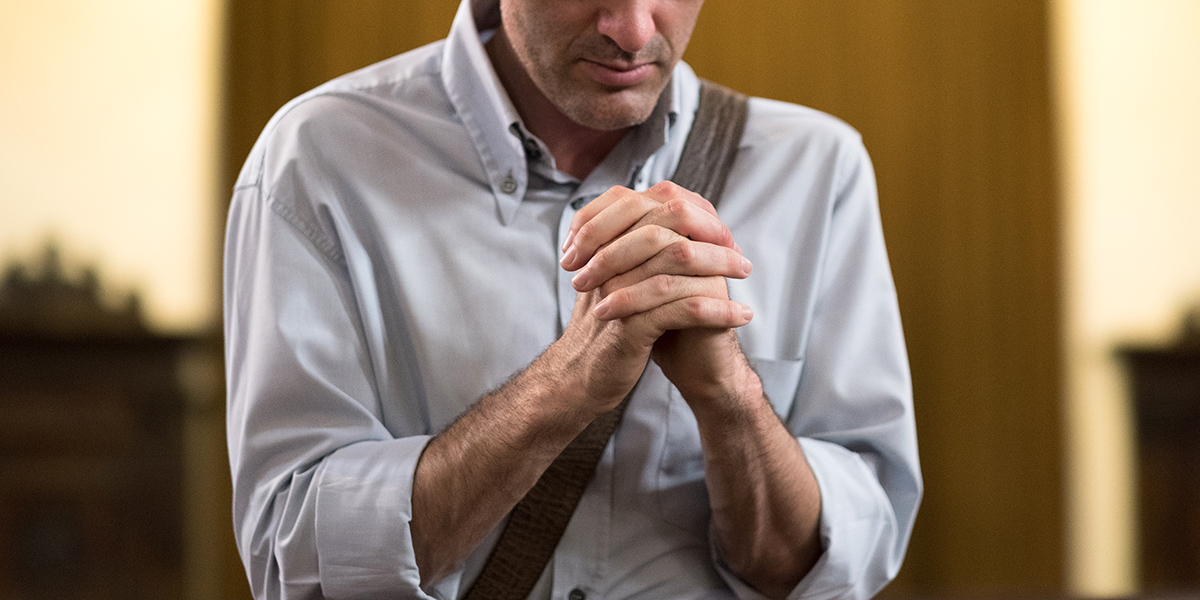 Why do Catholics genuflect in a church?