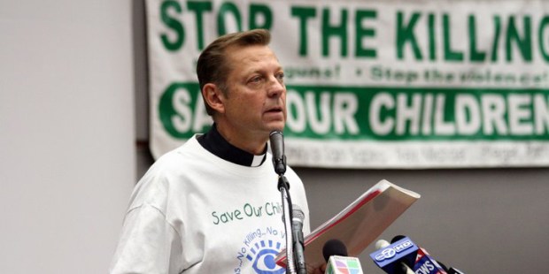 Stop Shooting: Priest led protest shuts down highway in Chicago