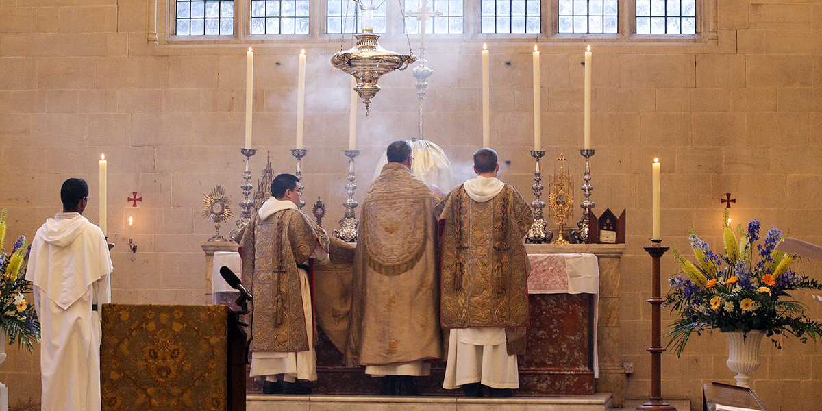 Why are saints’ relics placed inside altars?