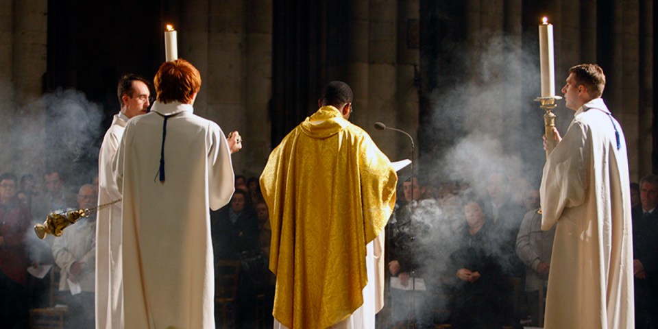 Why is the Gospel led by candles and incense at Mass?