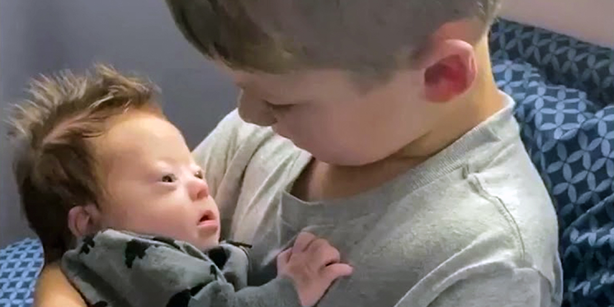 Video of boy singing to baby brother with Down syndrome goes viral