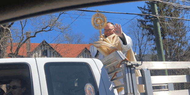Priest takes Blessed Sacrament on ride through NY town hit by coronavirus