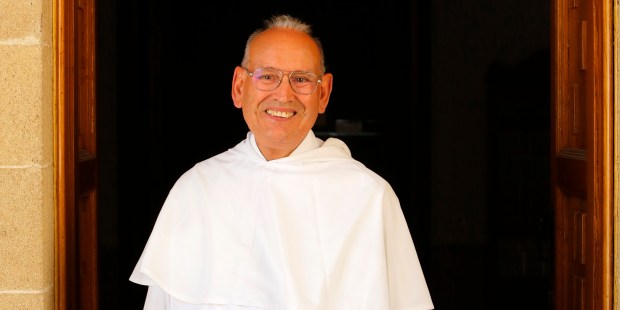 Why do Dominicans wear a white habit?