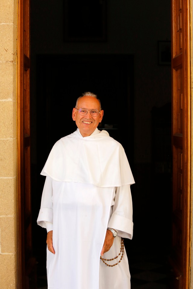 Why do Dominicans wear a white habit?