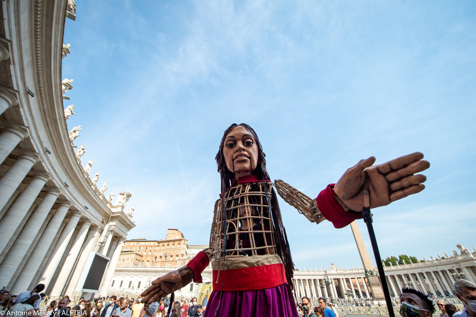 Giant puppet in St. Peter's Square draws attention to plight of migrants