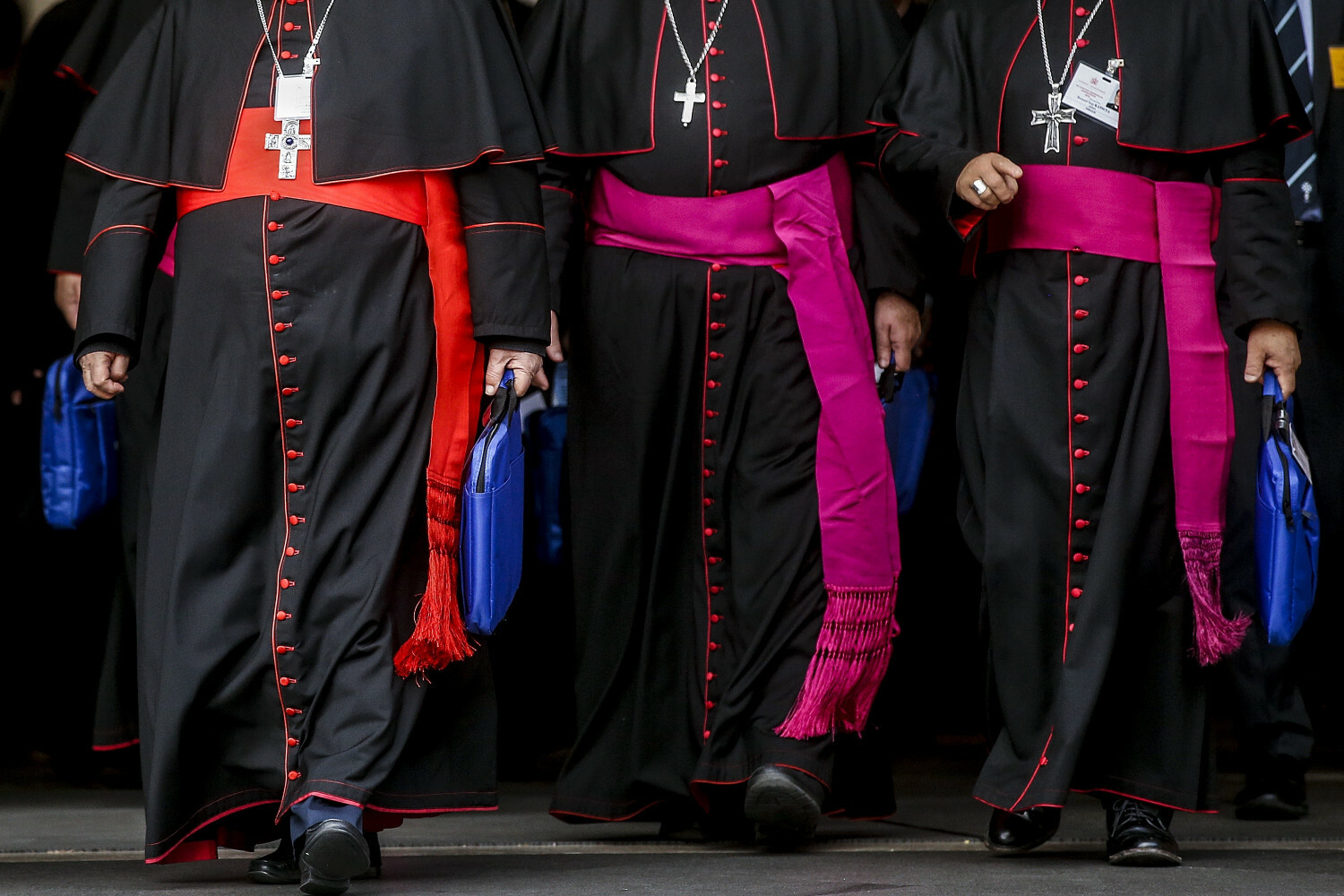 A clergy tailor breaks down the cardinals' red uniform