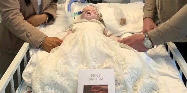 Dying UK baby baptized after parents feel "pull of Hell"