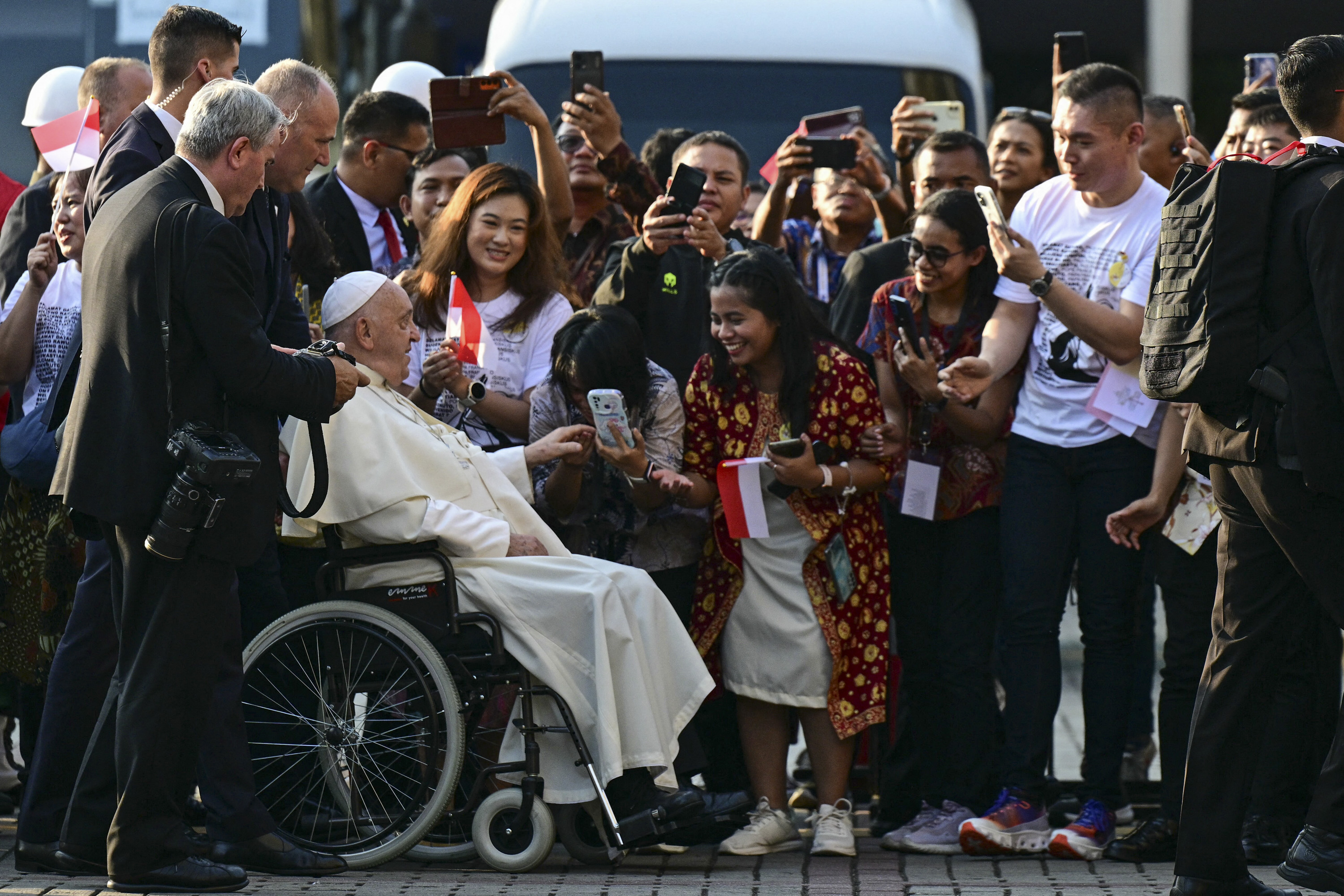 Pope met by cheering crowds on his busy day in Indonesia