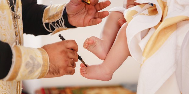 Baby's reaction to being baptized is perfection