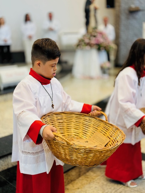 The joy of child with Down Syndrome as he becomes alter boy