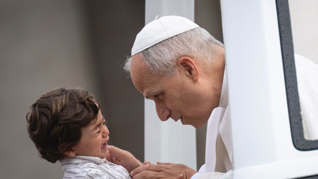 pope crying child